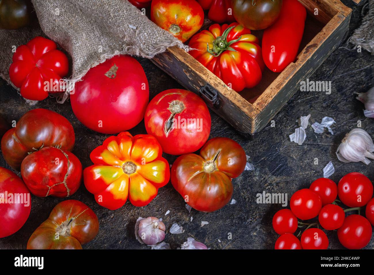 Top view of a harvest organic assorted tomatoes - red, yellow, orange ...