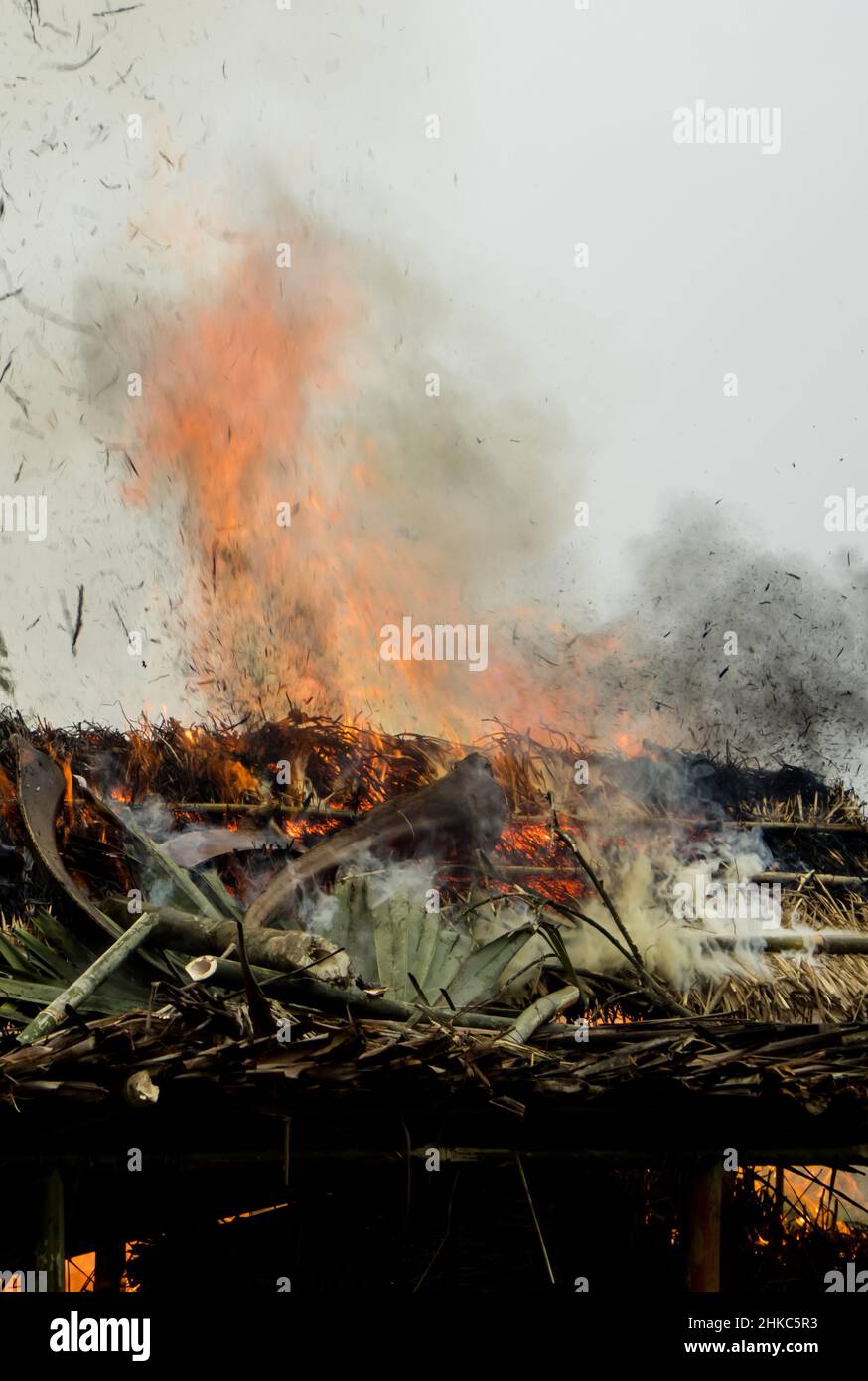 Fire in a cottage of a village burning it Stock Photo - Alamy