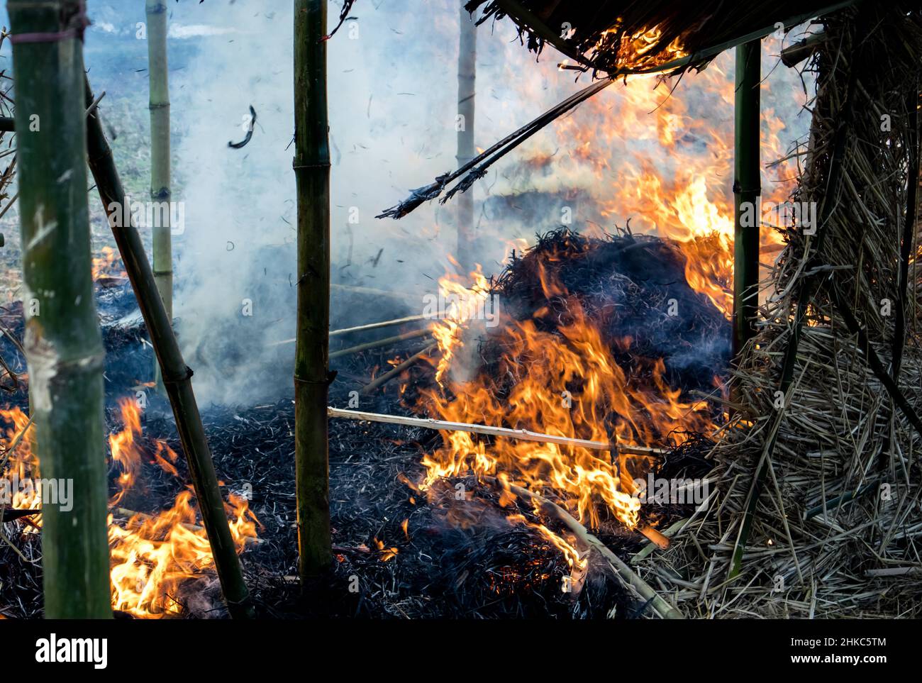 Fire in a cottage of a village burning it Stock Photo - Alamy