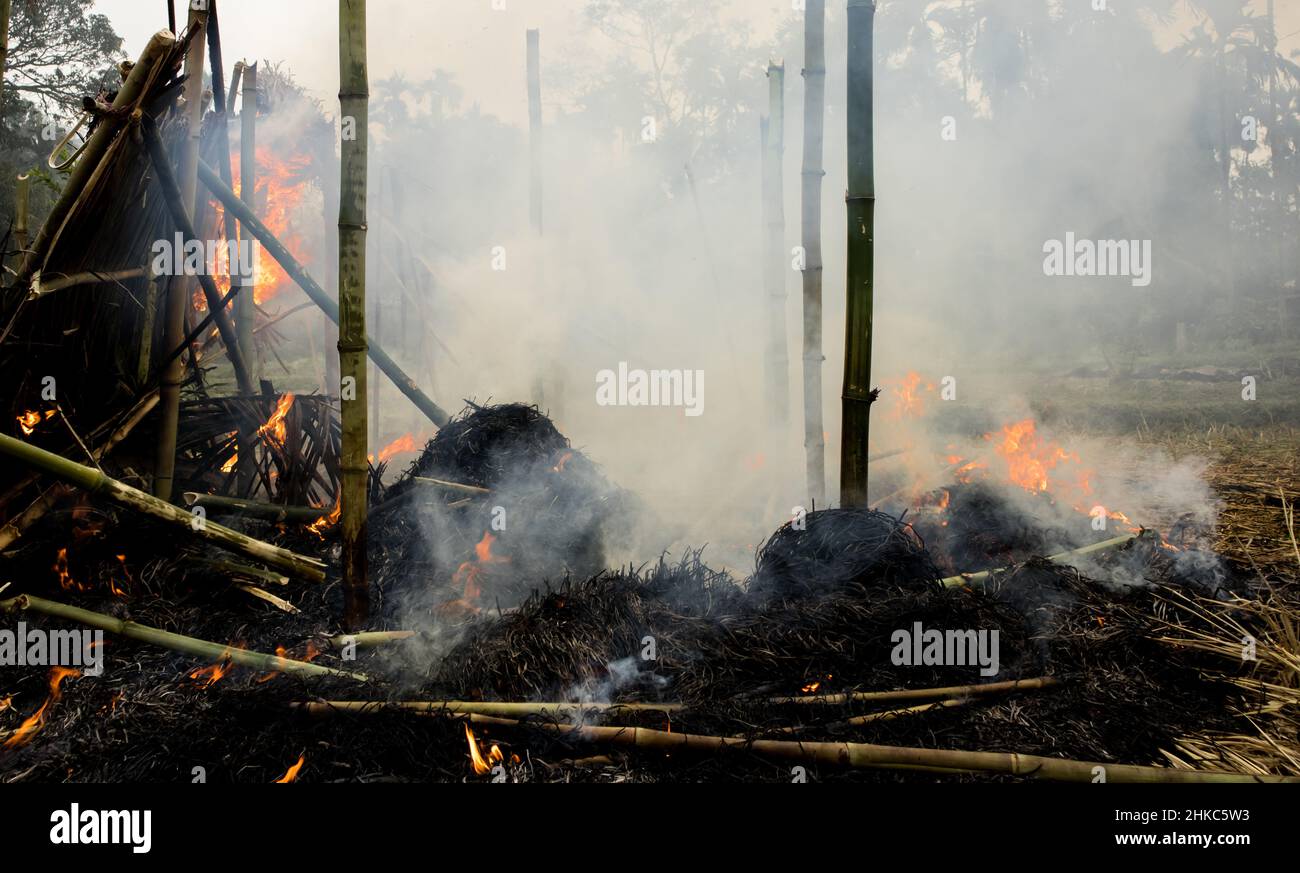 Fire in a cottage of a village burning it Stock Photo - Alamy