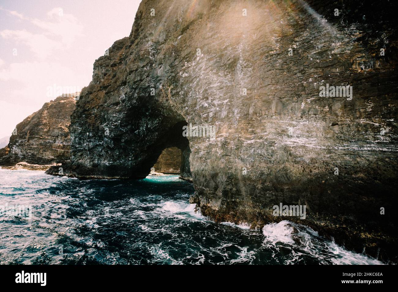 Turquoise Water Peeks Through a Secret Cove Rock Tunnel Stock Photo - Alamy