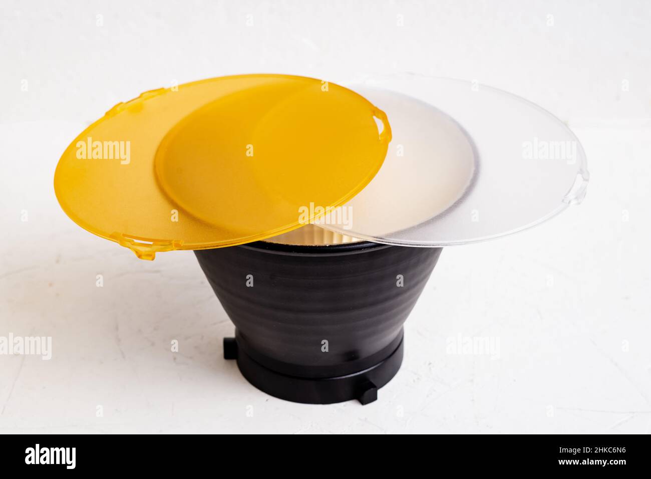 Standard reflector with matt white and yellow diffuser on a white ...
