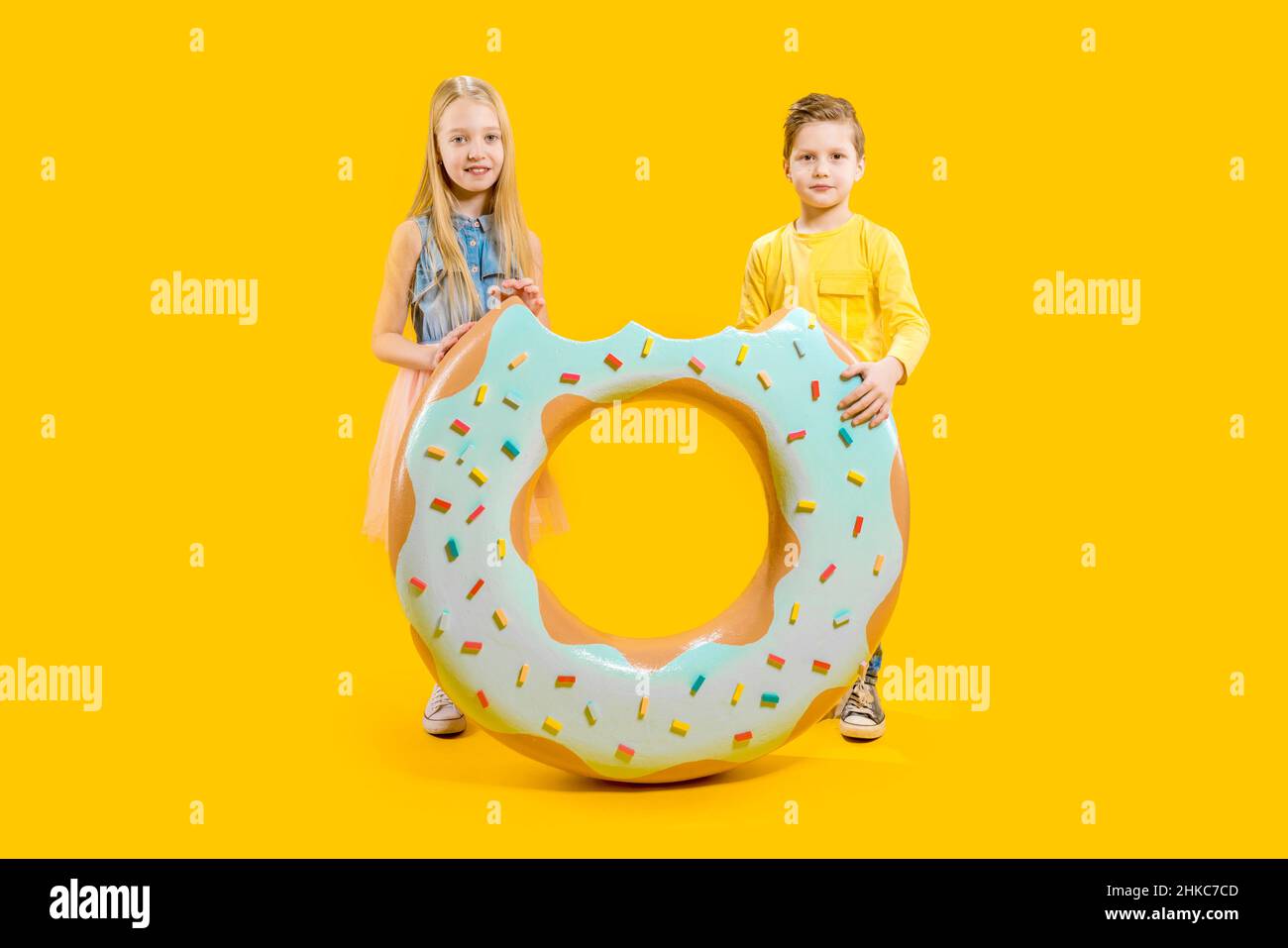 Delicious dessert. Confectionery. Sweetness. Children boy and girl are ...