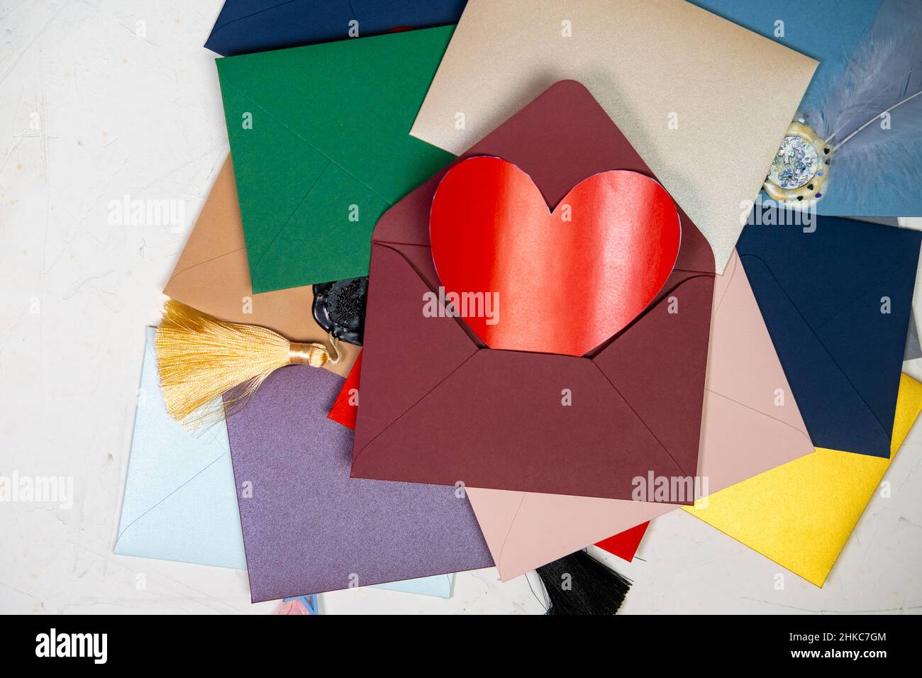 Red heart in an envelope. Lots of colorful envelopes. Envelopes sealed ...