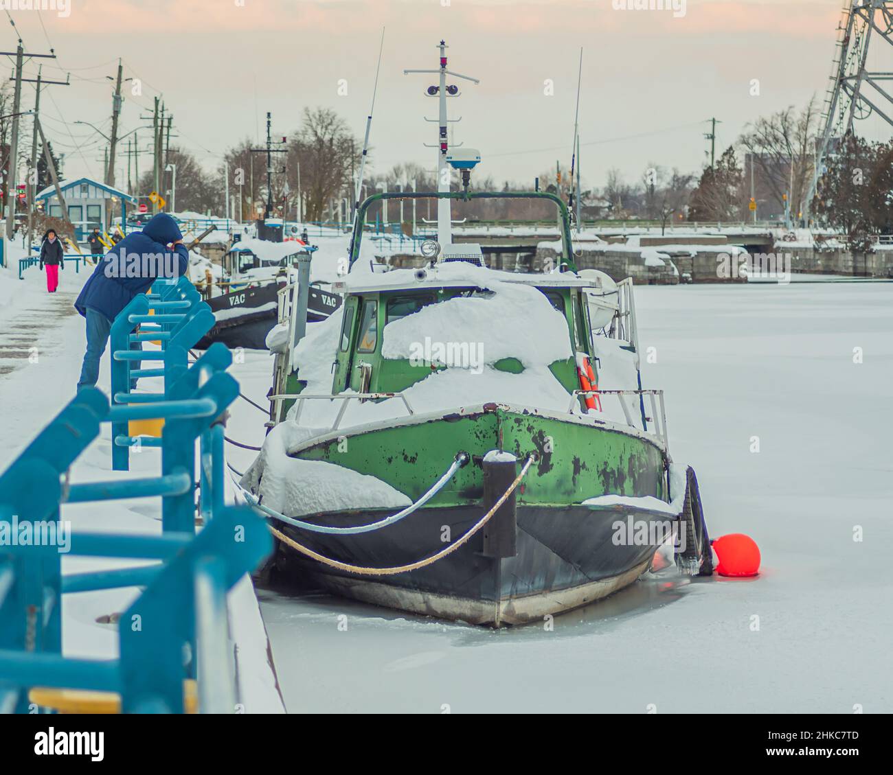 frozen boat in the river Stock Photo - Alamy