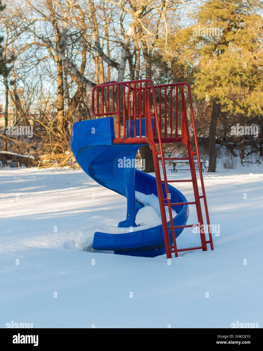 Children's slide with park with snow Stock Photo - Alamy