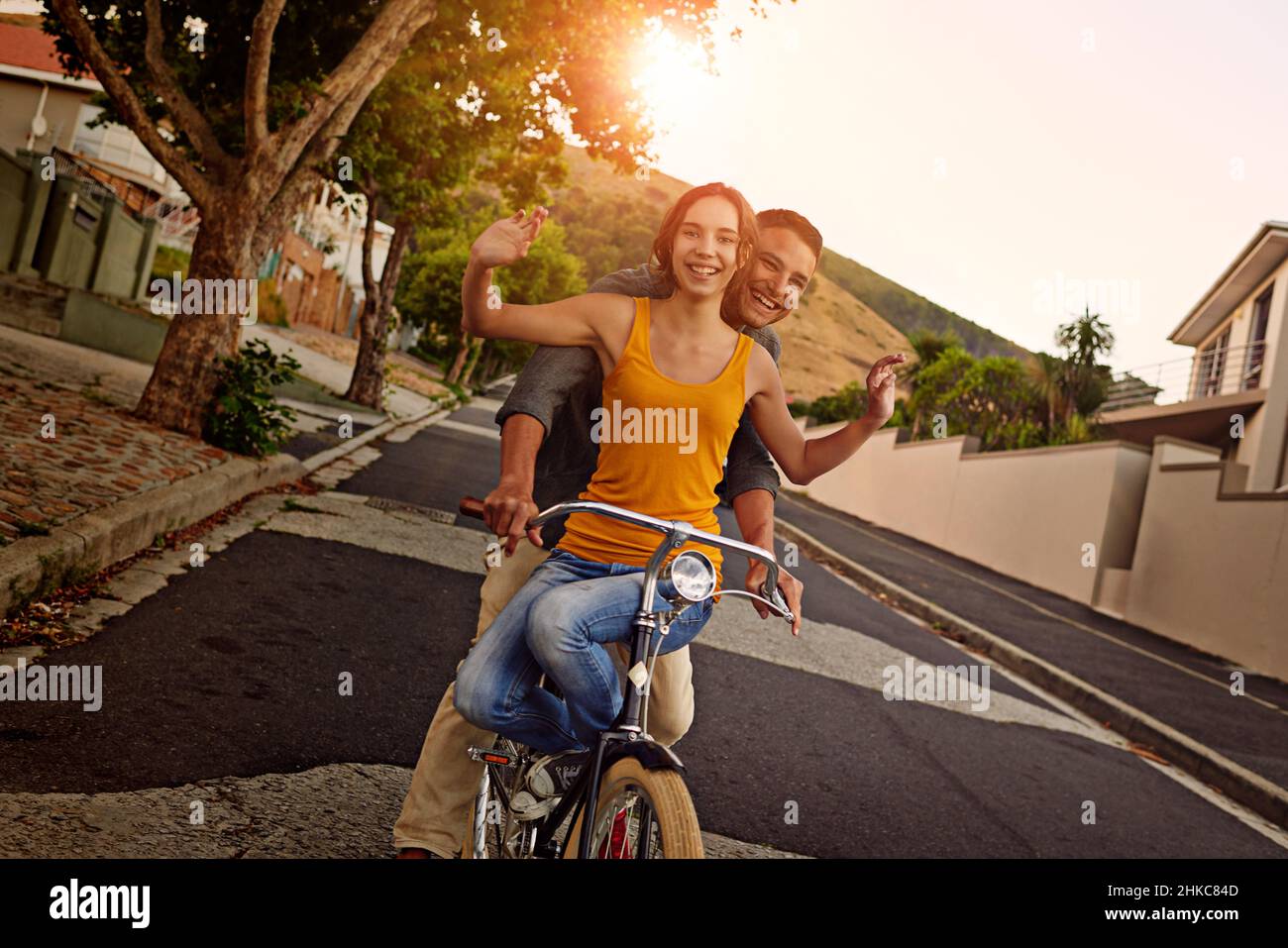 Live, love, ride. Shot of a happy young couple enjoying a bicycle ride ...