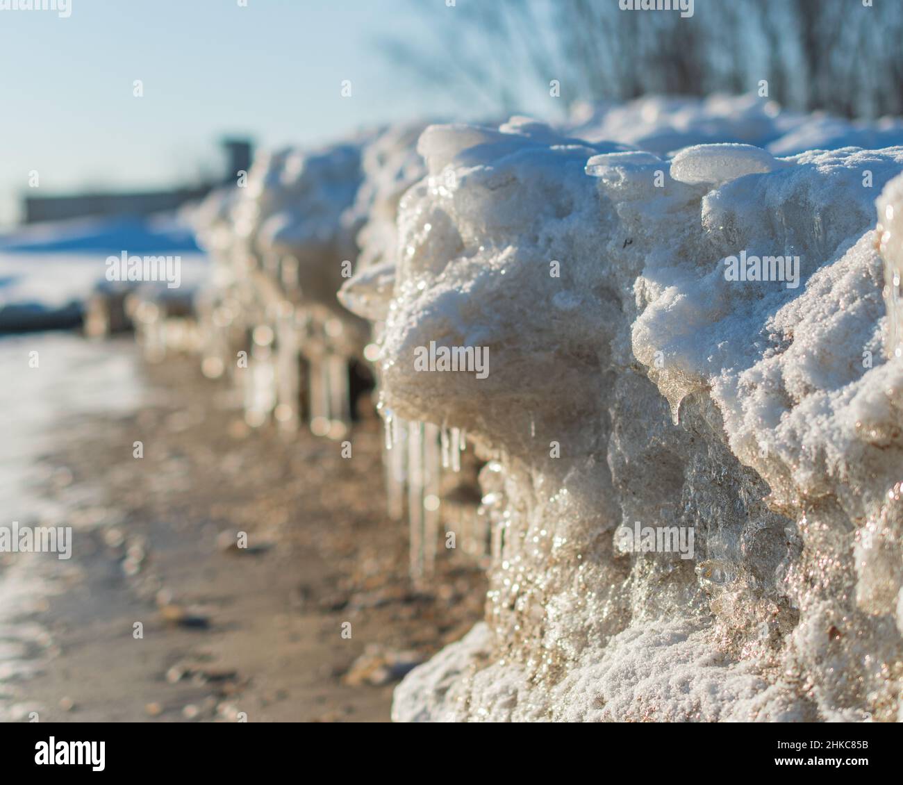 Frozen beach shore with ice and snow Stock Photo - Alamy