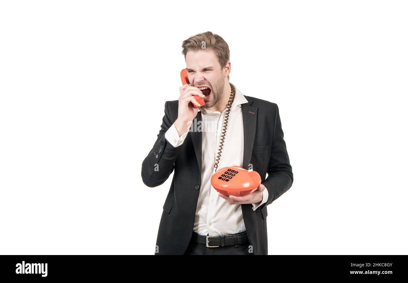 Line telephony. Angry man shout in telephone receiver. Businessman is ...