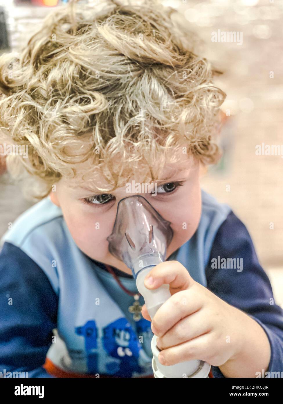 the child breathes the medicine through an inhaler Stock Photo - Alamy
