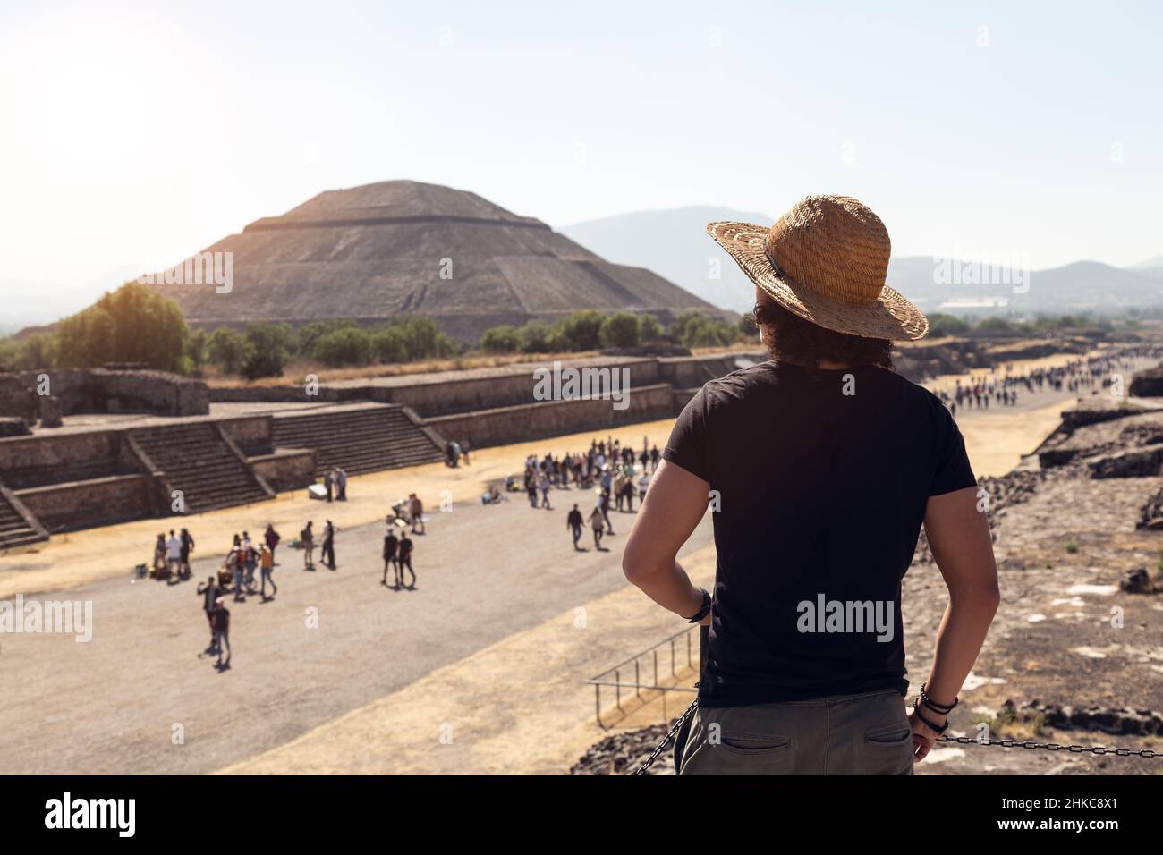 Man with hat staring at pyramids in Teotihuacan during sunrise Stock ...