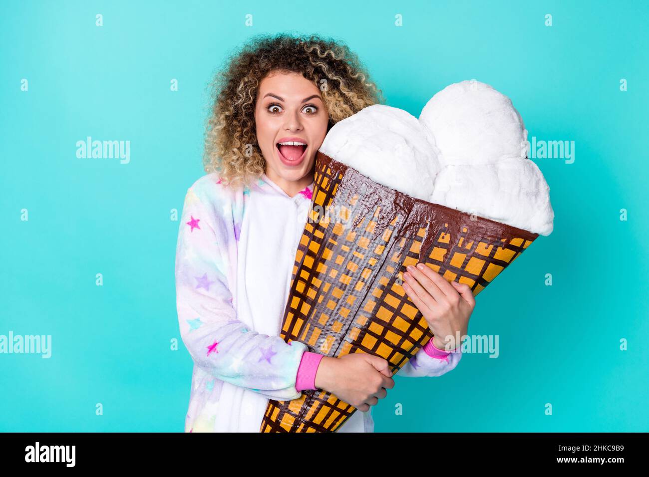 Photo of impressed millennial curly hairdo lady hug ice-cream wear ...
