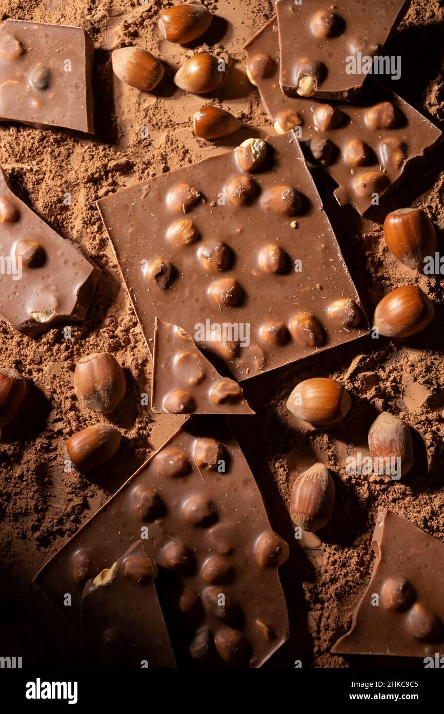 Dark chocolate background by chocolate pieces, and cocoa powder Stock ...