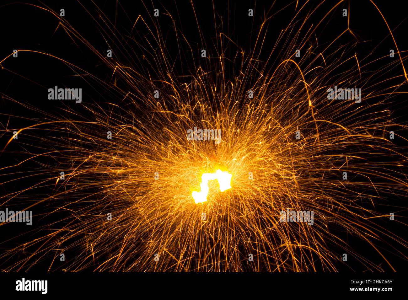 Close-up short exposure photo of a single burning sparkler, producing ...