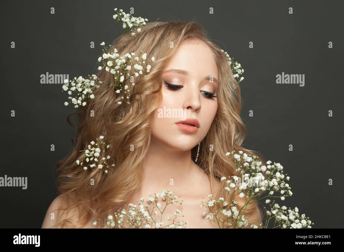 Beauty woman with bouquet indoors. Female portrait of cute lady. Woman ...