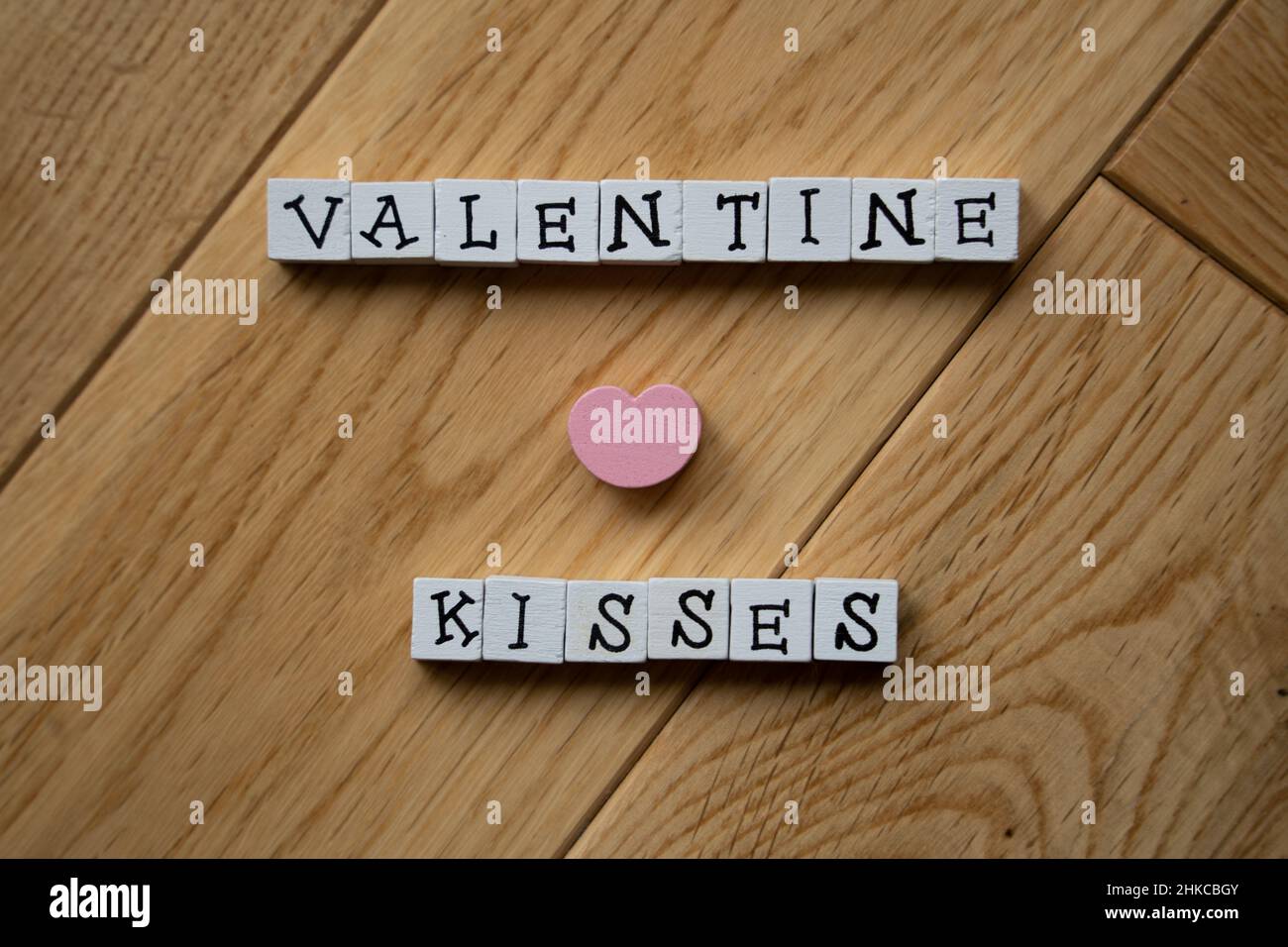 White wooden letter blocks with black capital letters spell out a St ...