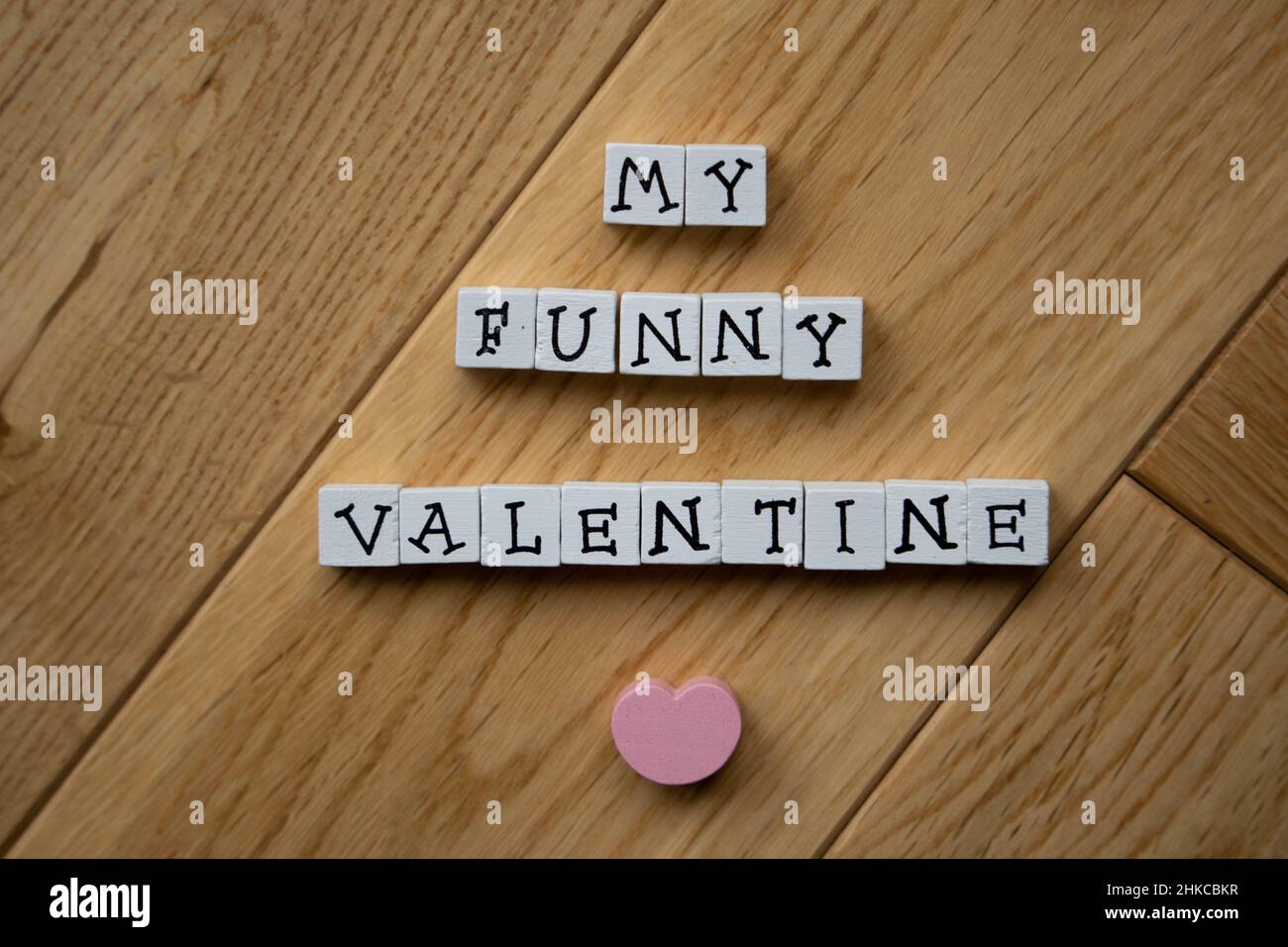 White wooden letter blocks with black capital letters spell out a St ...