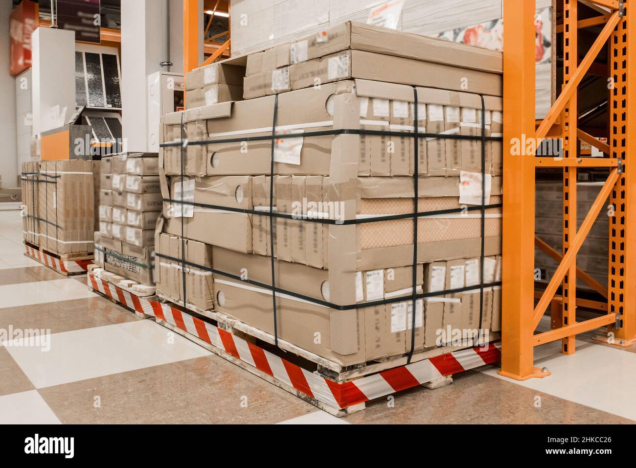 Building materials or construction goods packed in cardboard are stored ...
