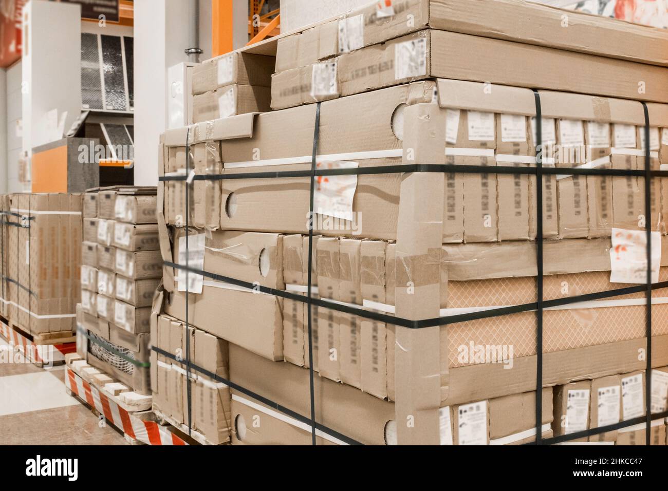 Building materials or construction goods packed in cardboard are stored ...