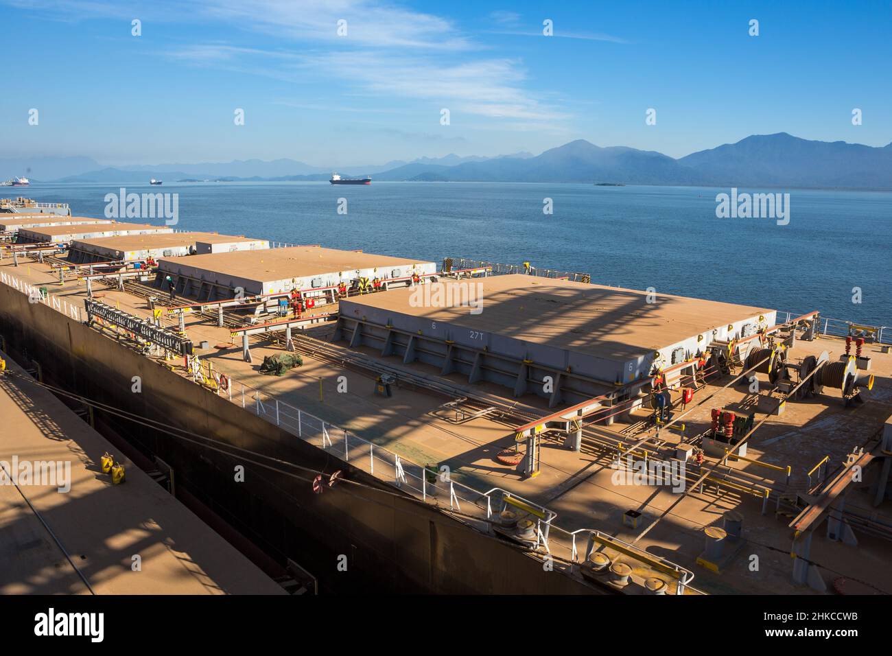 Bulk carrier cargo ship loaded with soy at sea port on sunny summer day ...