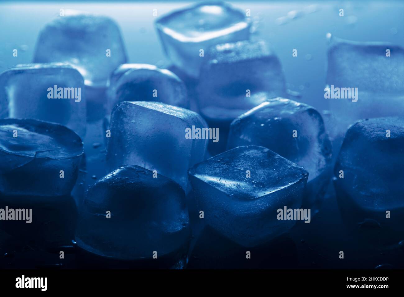 Ice cubes melting on the table Stock Photo - Alamy