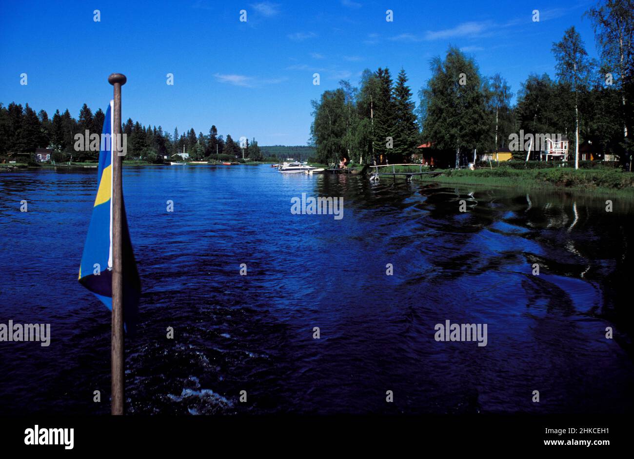 UMEA, SWEDEN IN 1998, analog. Swedish Stern flag on a boat. Channel ...