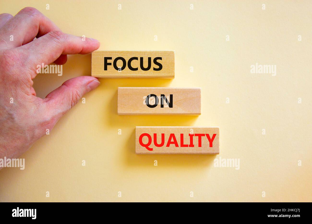 Focus on quality symbol. Concept words Focus on quality on blocks on ...