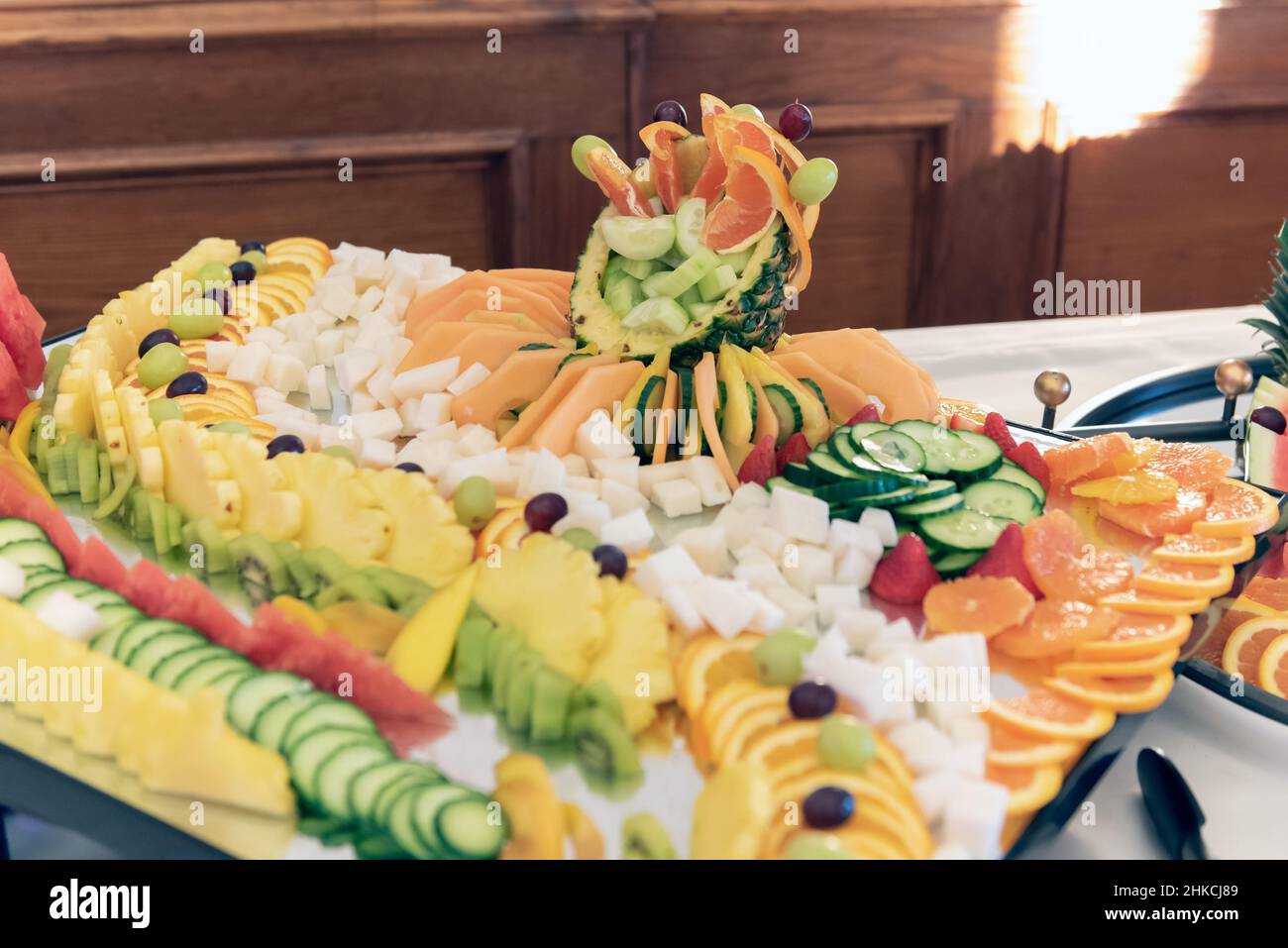 Pineapple and sliced citrus fruit display on the buffet table provides ...