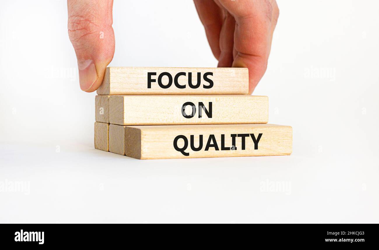 Focus on quality symbol. Concept words Focus on quality on blocks on ...