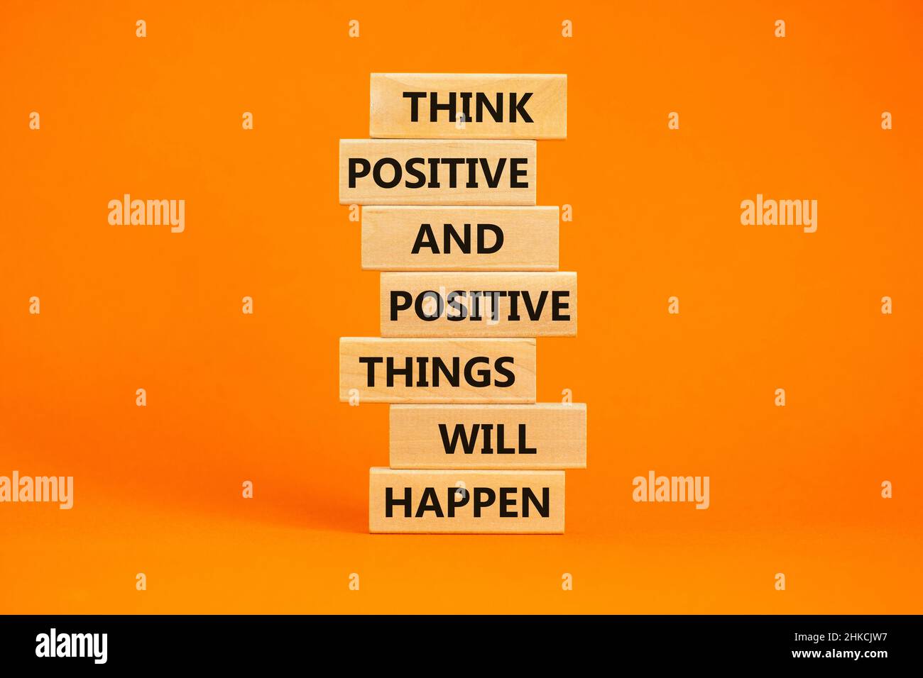 Think positive symbol. Wooden blocks with words Think positive and ...
