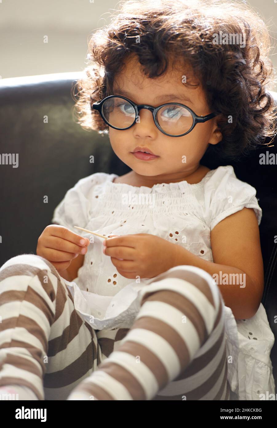 Learning as she grows. Shot of a cute little girl at home Stock Photo ...