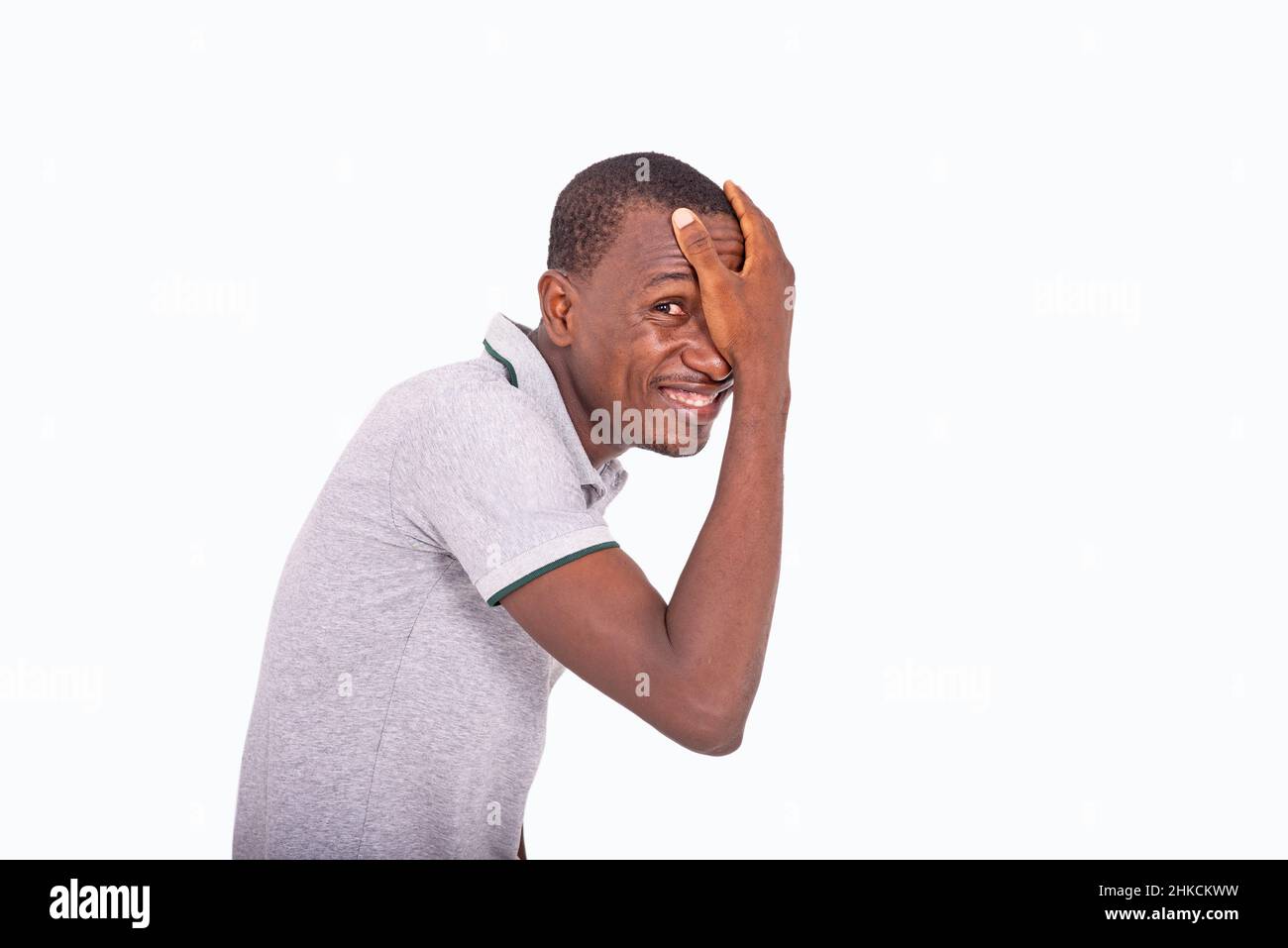 Young man covering one eye hi-res stock photography and images - Alamy