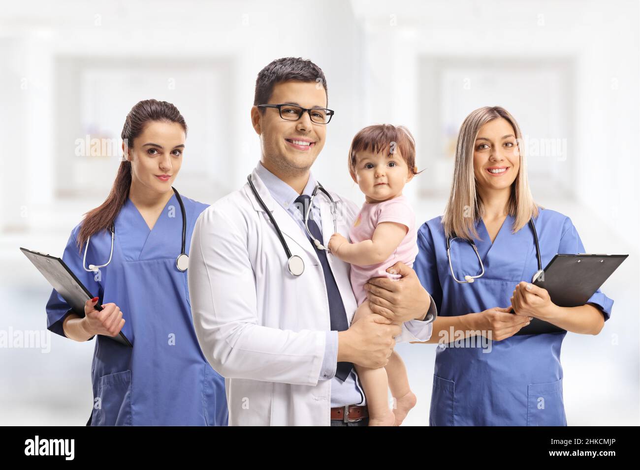 Team of pediatricians with a baby at a hospital Stock Photo - Alamy