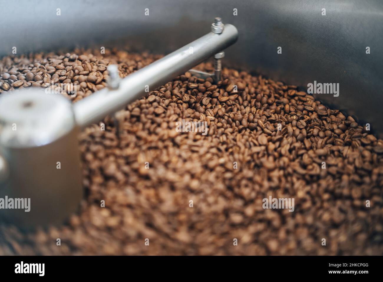 Roasted coffee beans in the process Stock Photo - Alamy