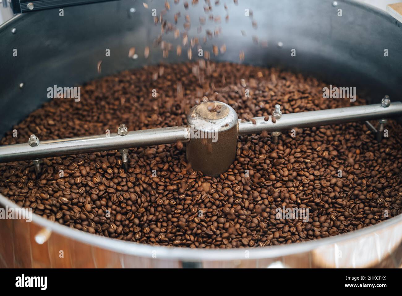 Roasted coffee beans in the process Stock Photo - Alamy