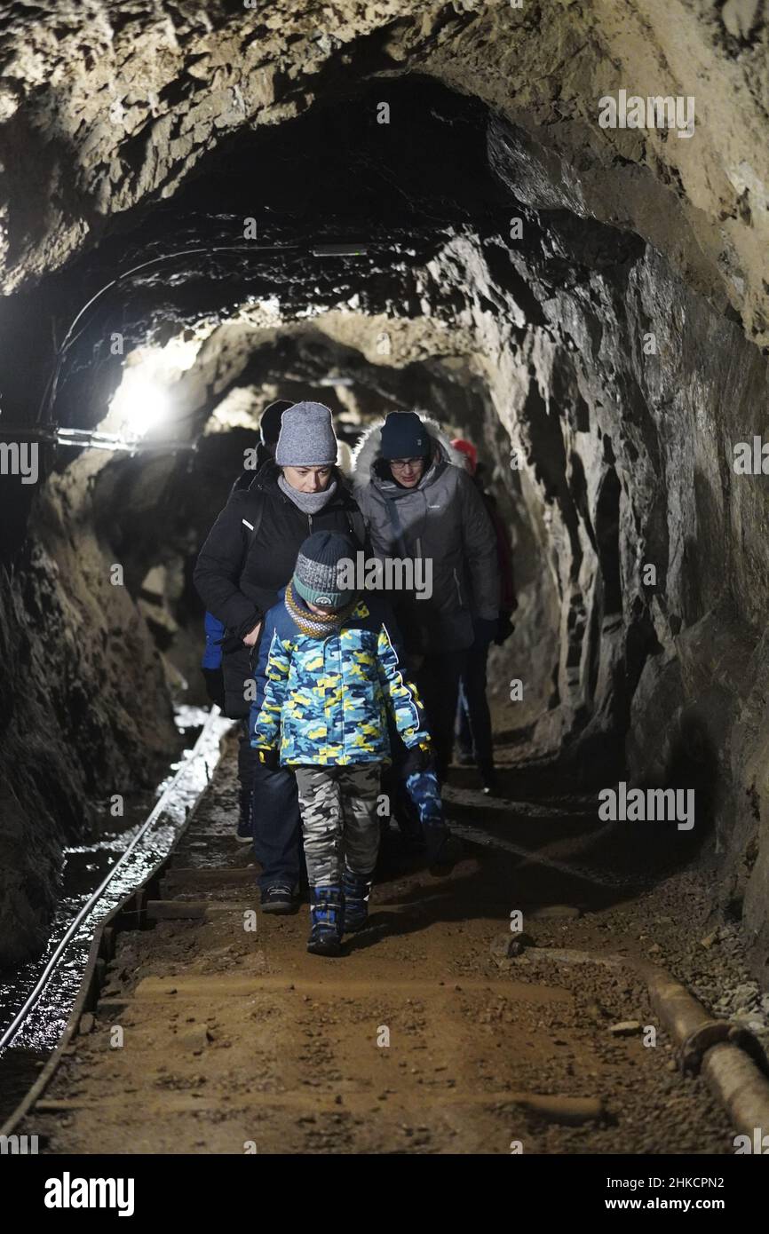 People walking in a mine Stock Photo - Alamy