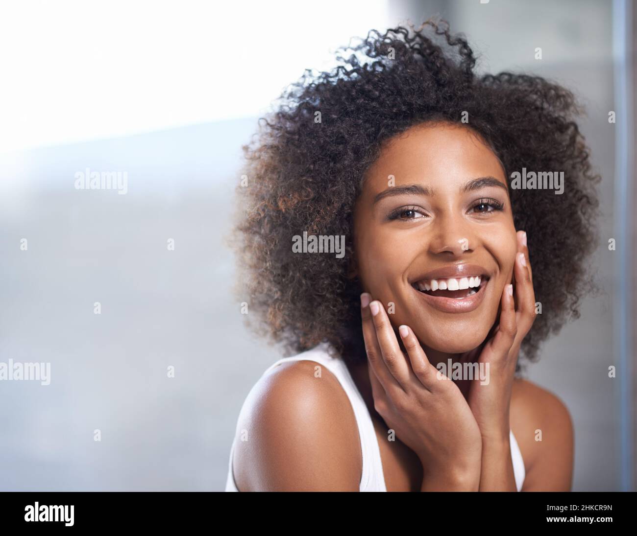 Smooth skin puts a smile on her face Stock Photo - Alamy