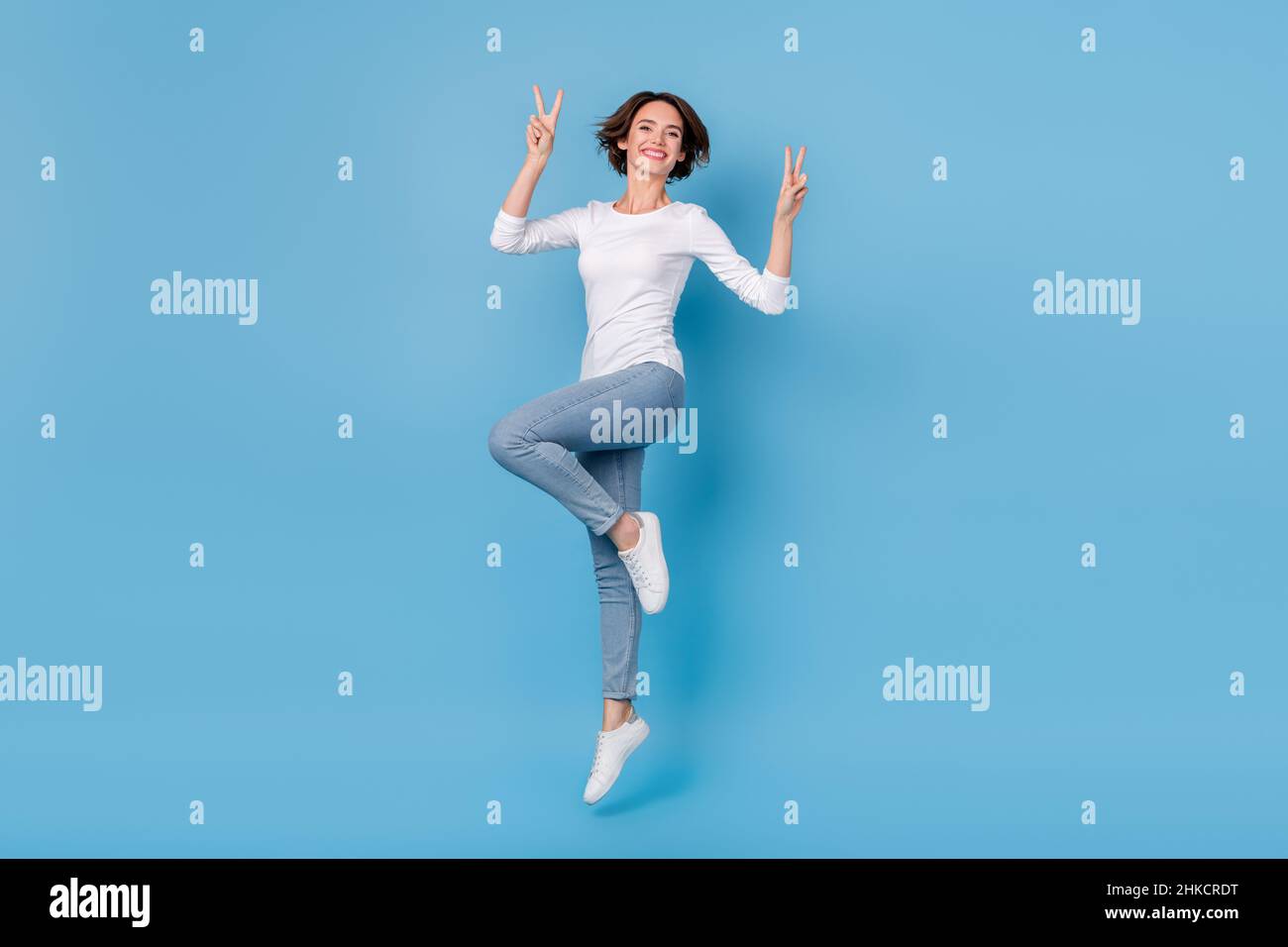 Full size photo of excited crazy positive girl jumping up fooling ...