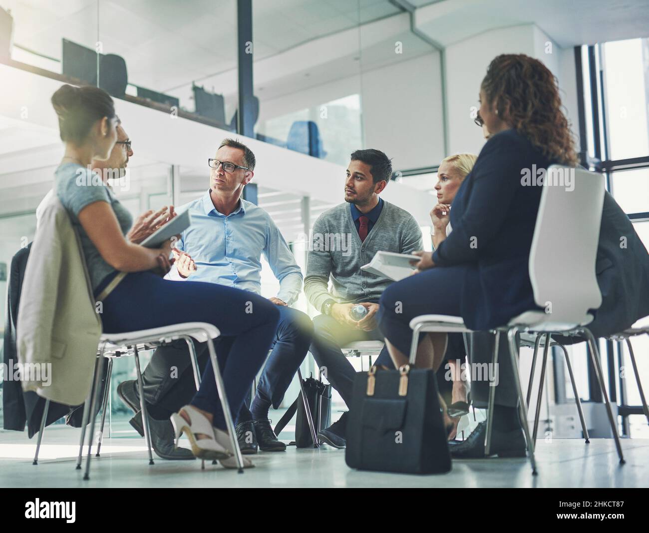 Coworkers talking in a circle hi-res stock photography and images - Alamy