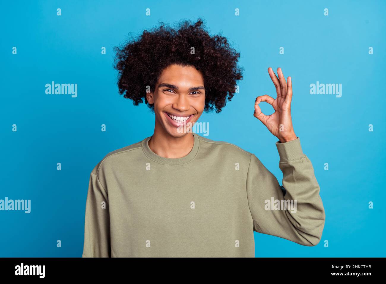 Photo of young man show fingers okey symbol great decide recommend ads ...