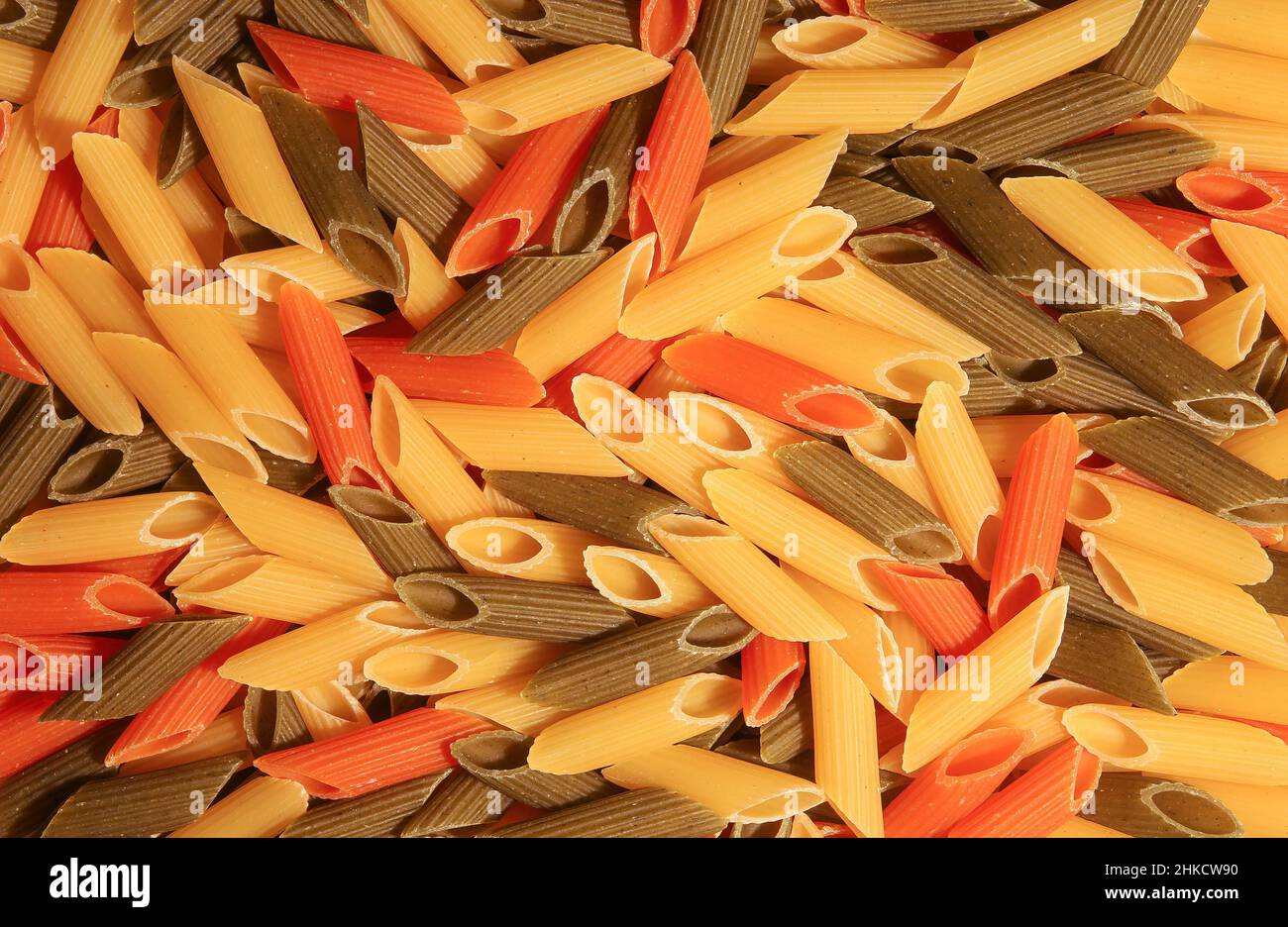 Full frame closeup of many raw cylinder shaped penne rigate pasta ...