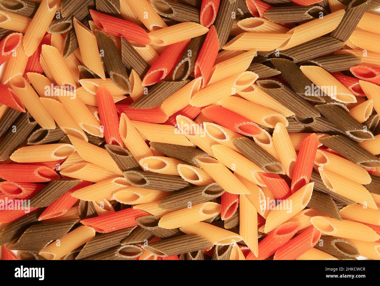 Full frame closeup of many raw cylinder shaped penne rigate pasta ...