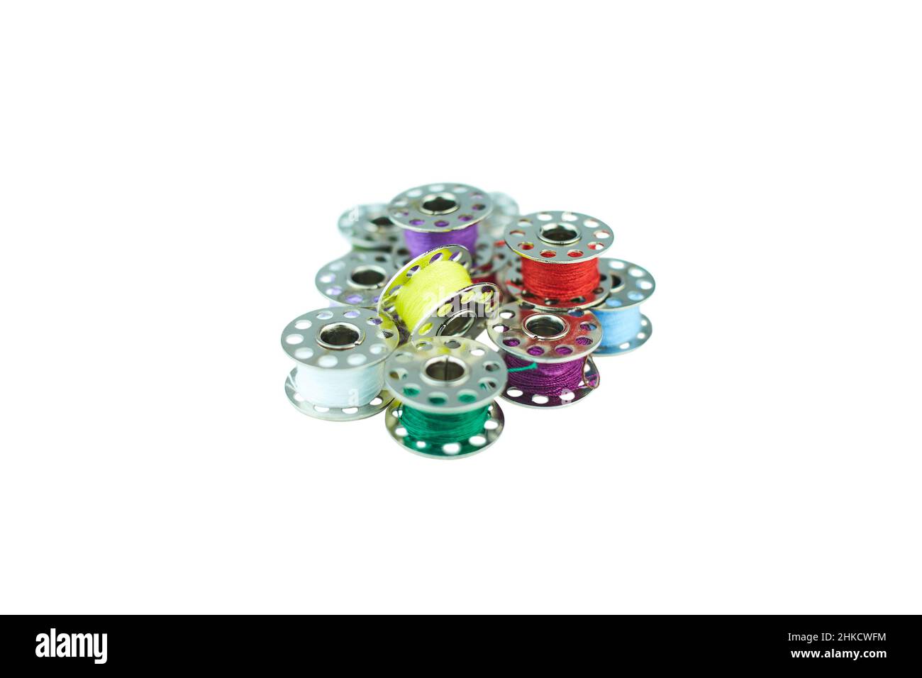 Colorful bobbins for machine sewing isolated on white background ...