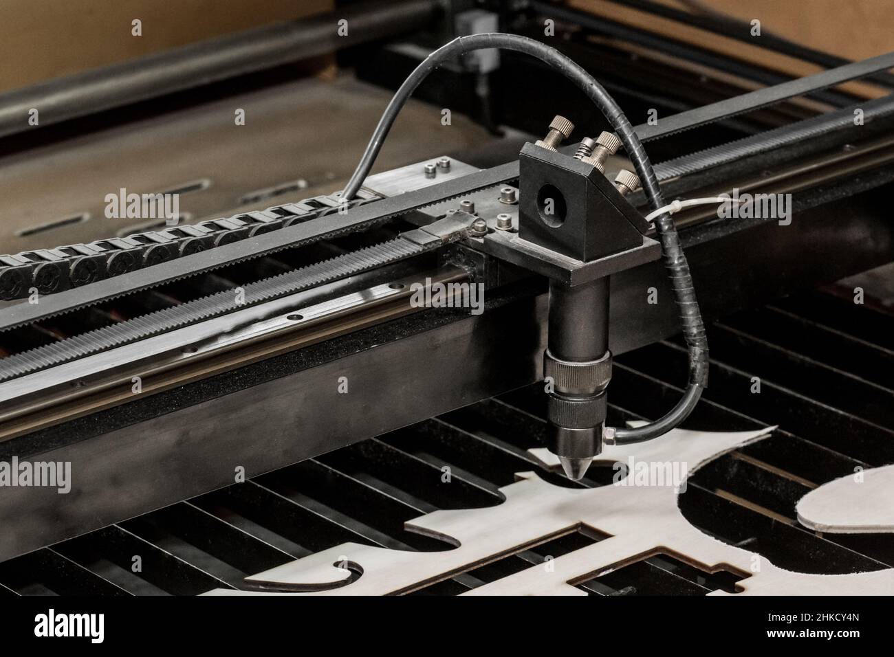 The process of laser cutting on wood on the equipment and tool of the ...