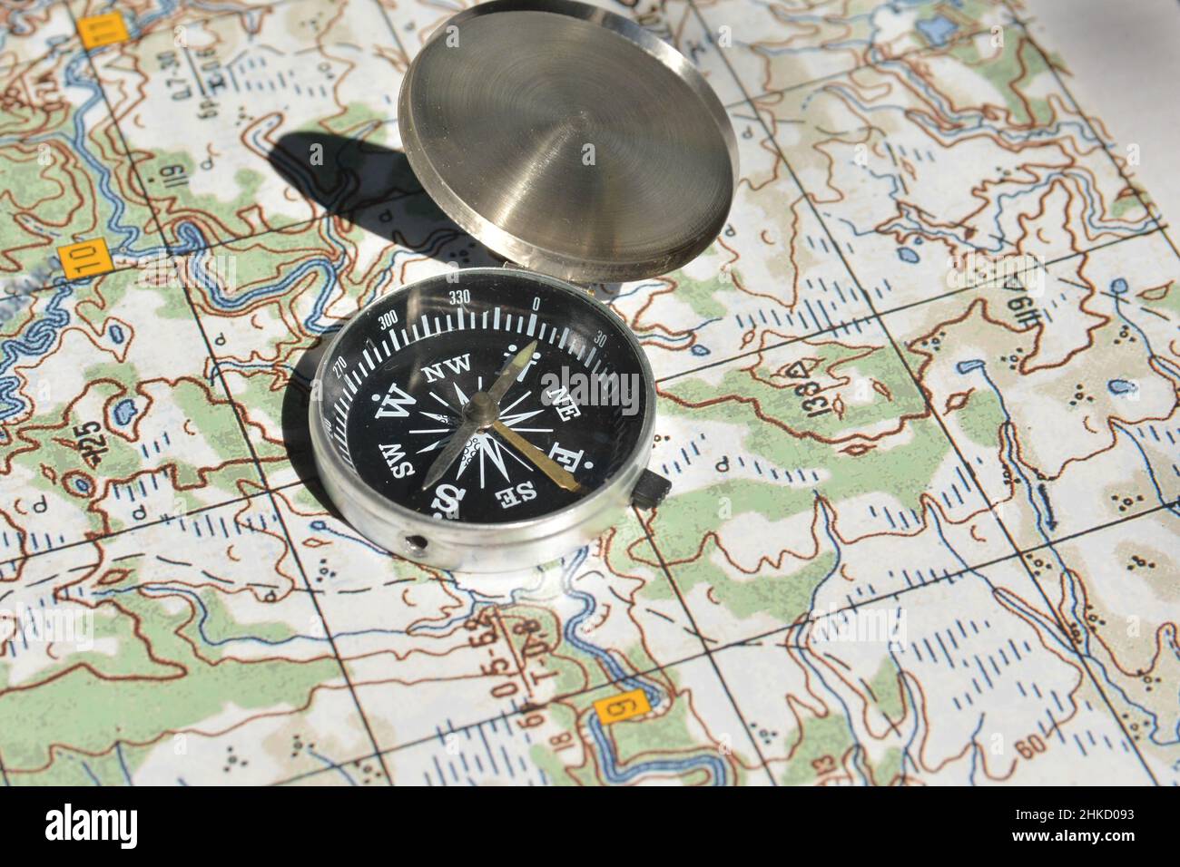 Magnetic compass. Compass on the background of the map Stock Photo - Alamy