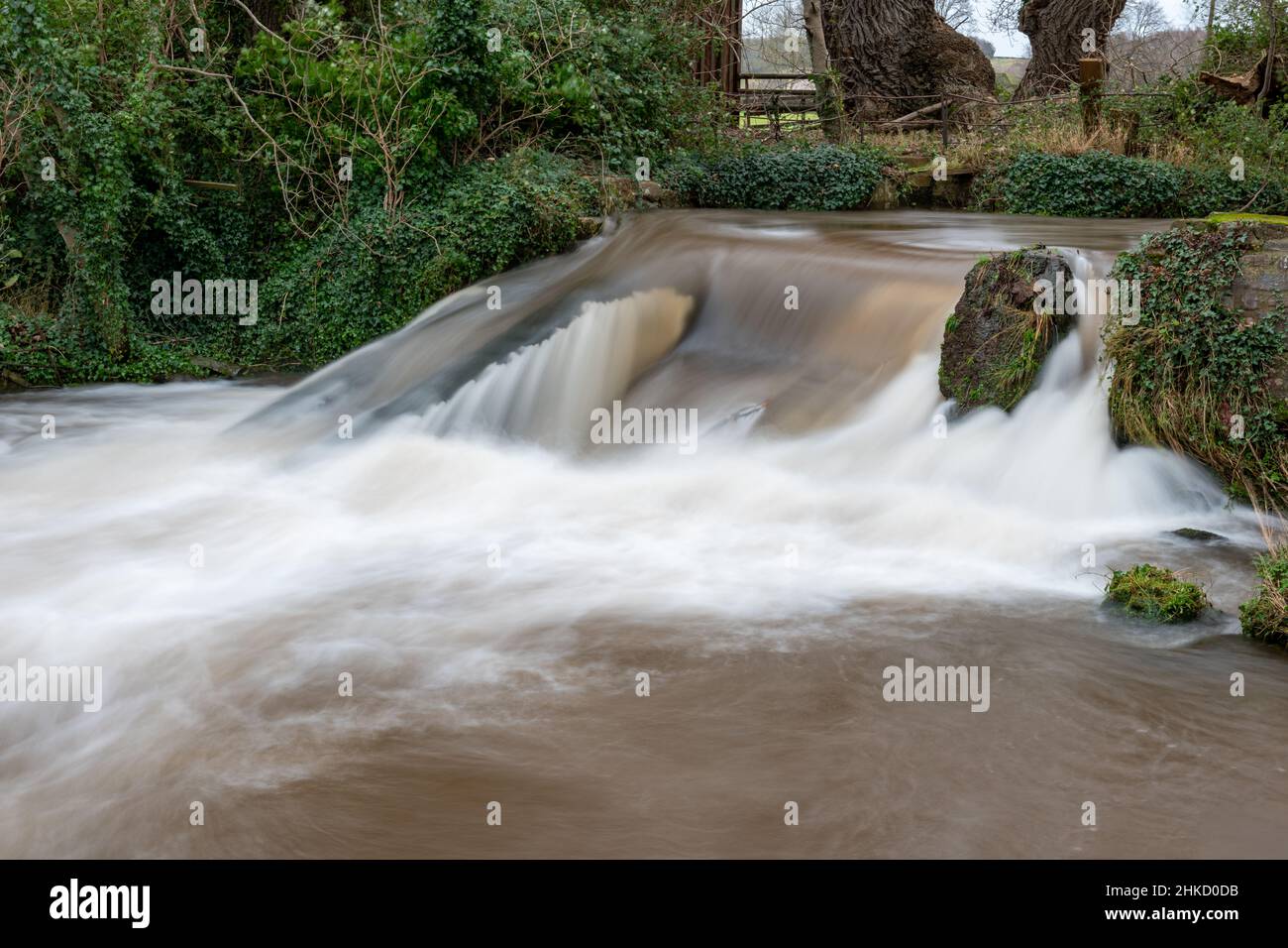 Long exposure of a waterfall on the river Avill in Dunster in Somerset ...