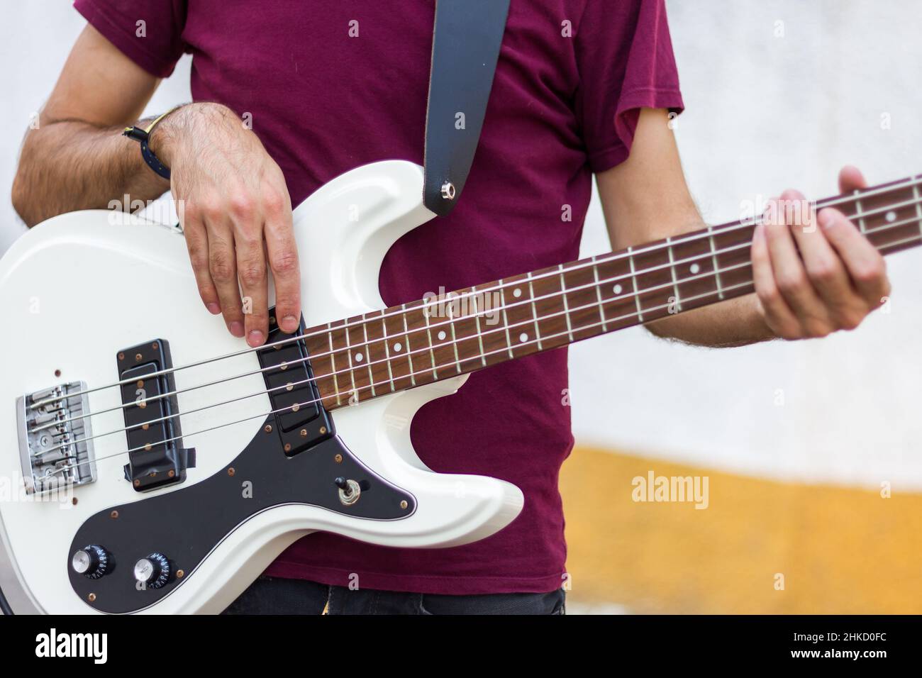 Guy playing bass guitar Stock Photo - Alamy