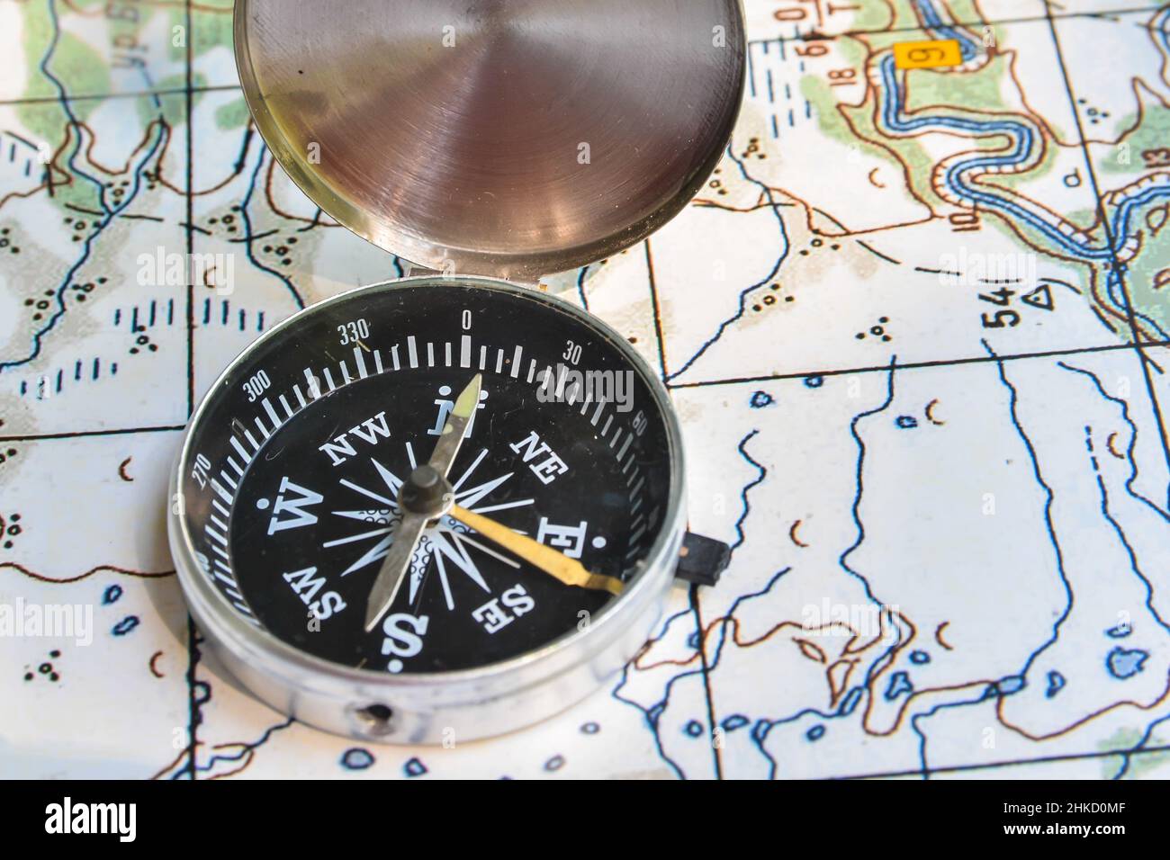 Magnetic compass. Compass on the background of the map Stock Photo - Alamy
