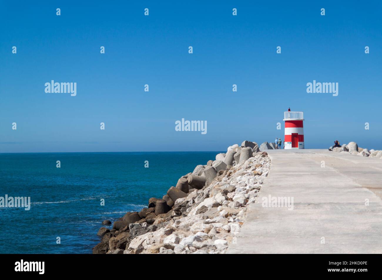 View of the sea and lighthouse on top of rocks in Nazare Stock Photo ...