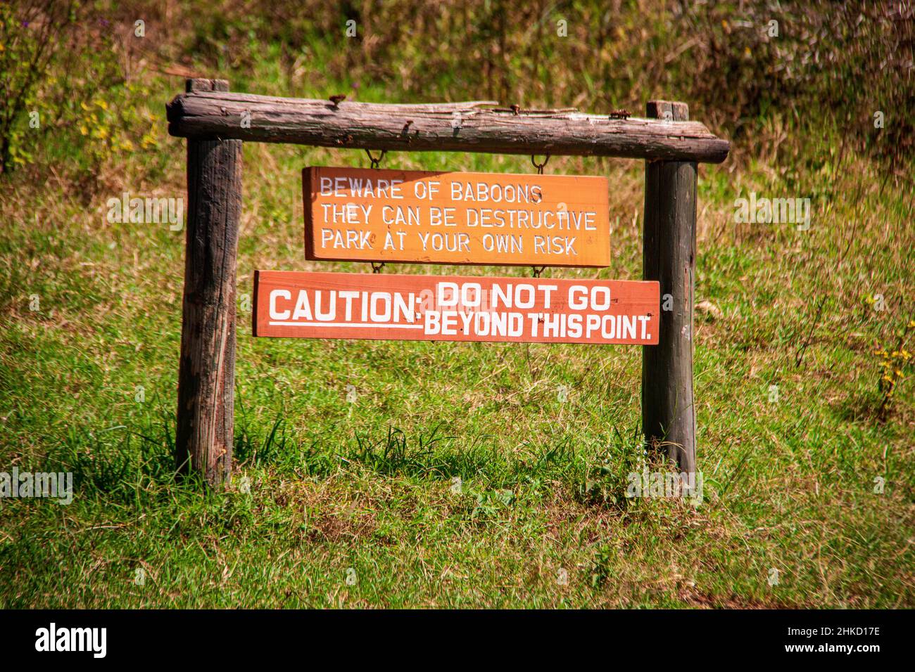 View of a sign "Beware of baboons, they can be destructive, do not go ...